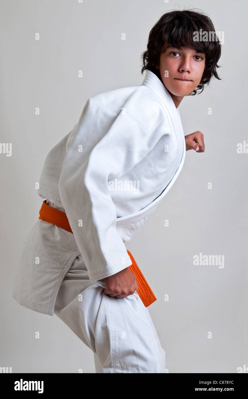 Young fighter posing isolated against a light background Stock Photo ...