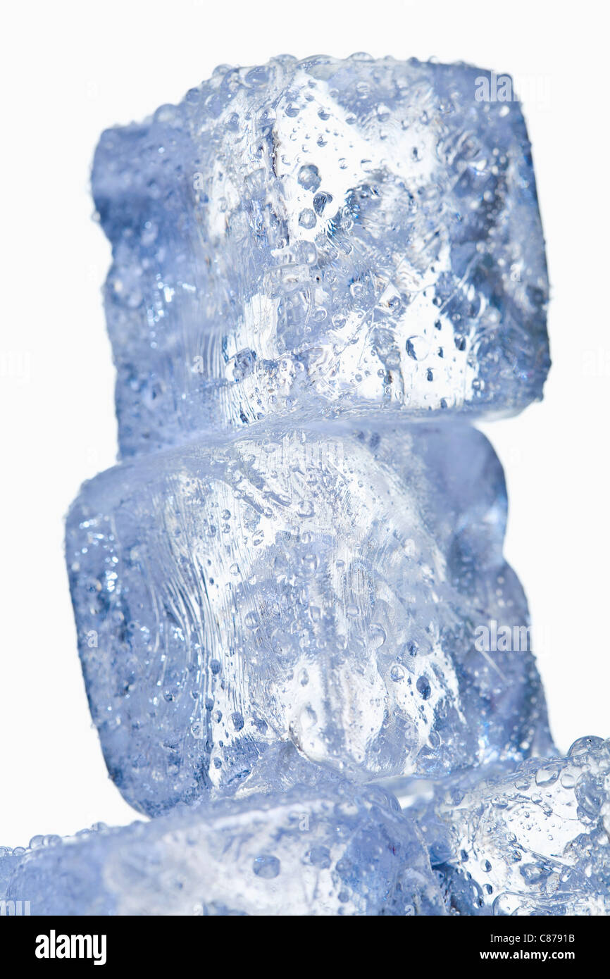Stack of ice cubes against white background, close up Stock Photo - Alamy