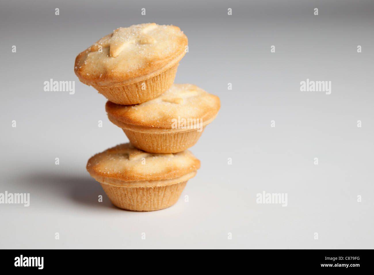 Three mince pies, placed on top of each other to make a tower Stock ...