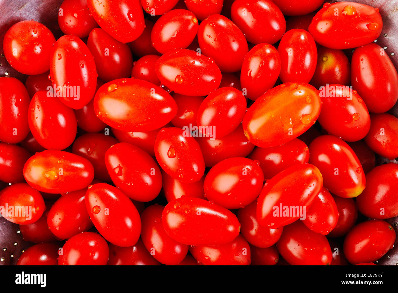 Red ripe tomatoes background Stock Photo - Alamy