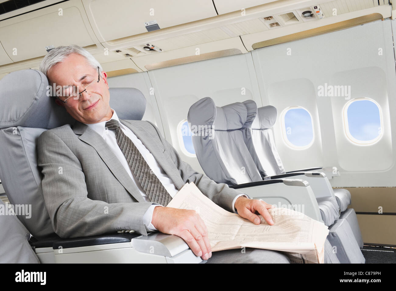 Businessman sleeping in airplane hi-res stock photography and images ...