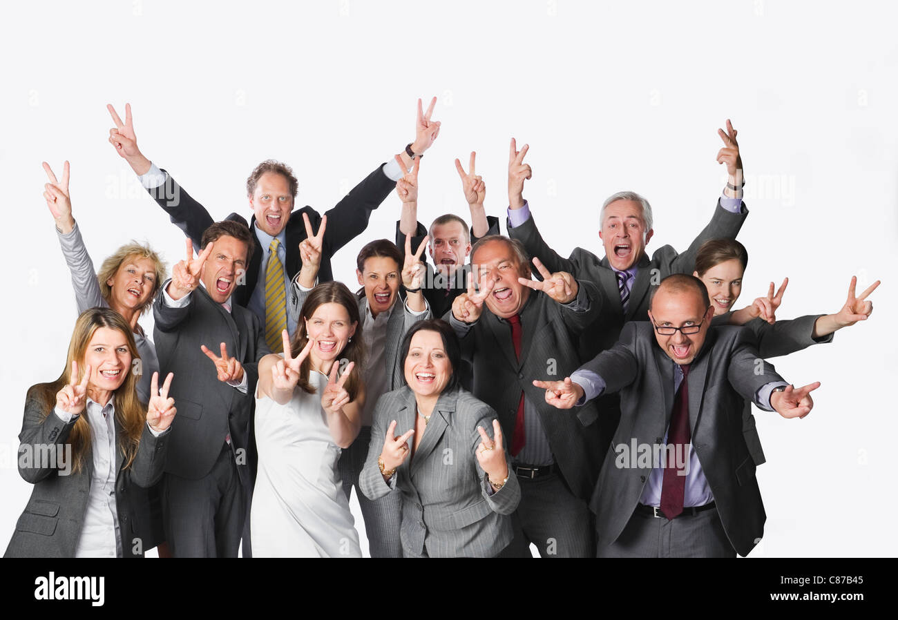 Large group of business people with victory sign against white ...