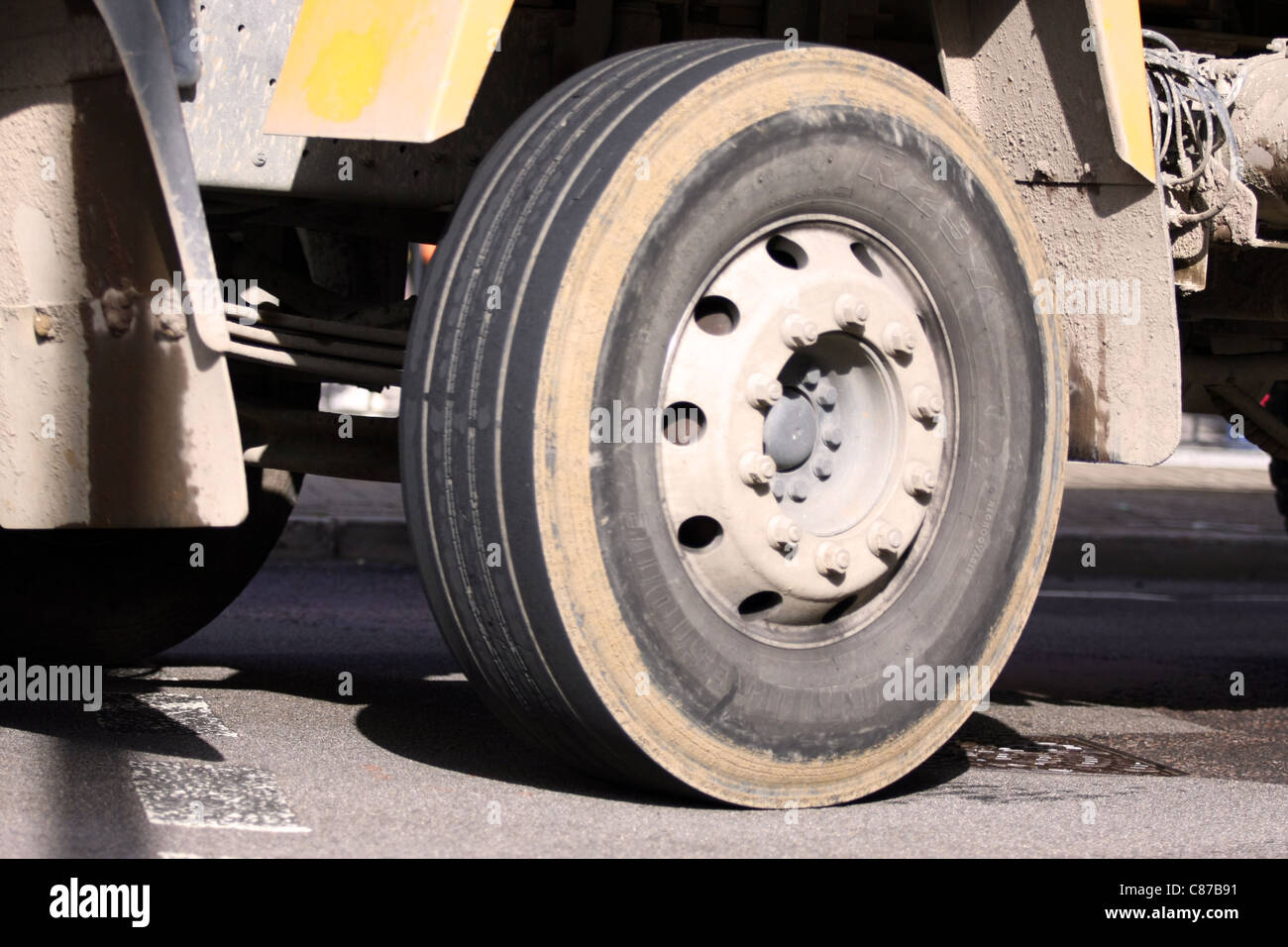 a low level view of a truck wheel as it travels along a road Stock ...