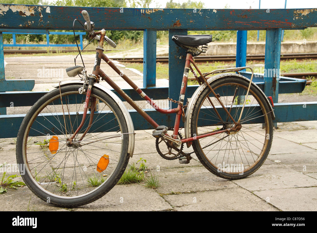 Bicycle chained to railing Stock Photo - Alamy