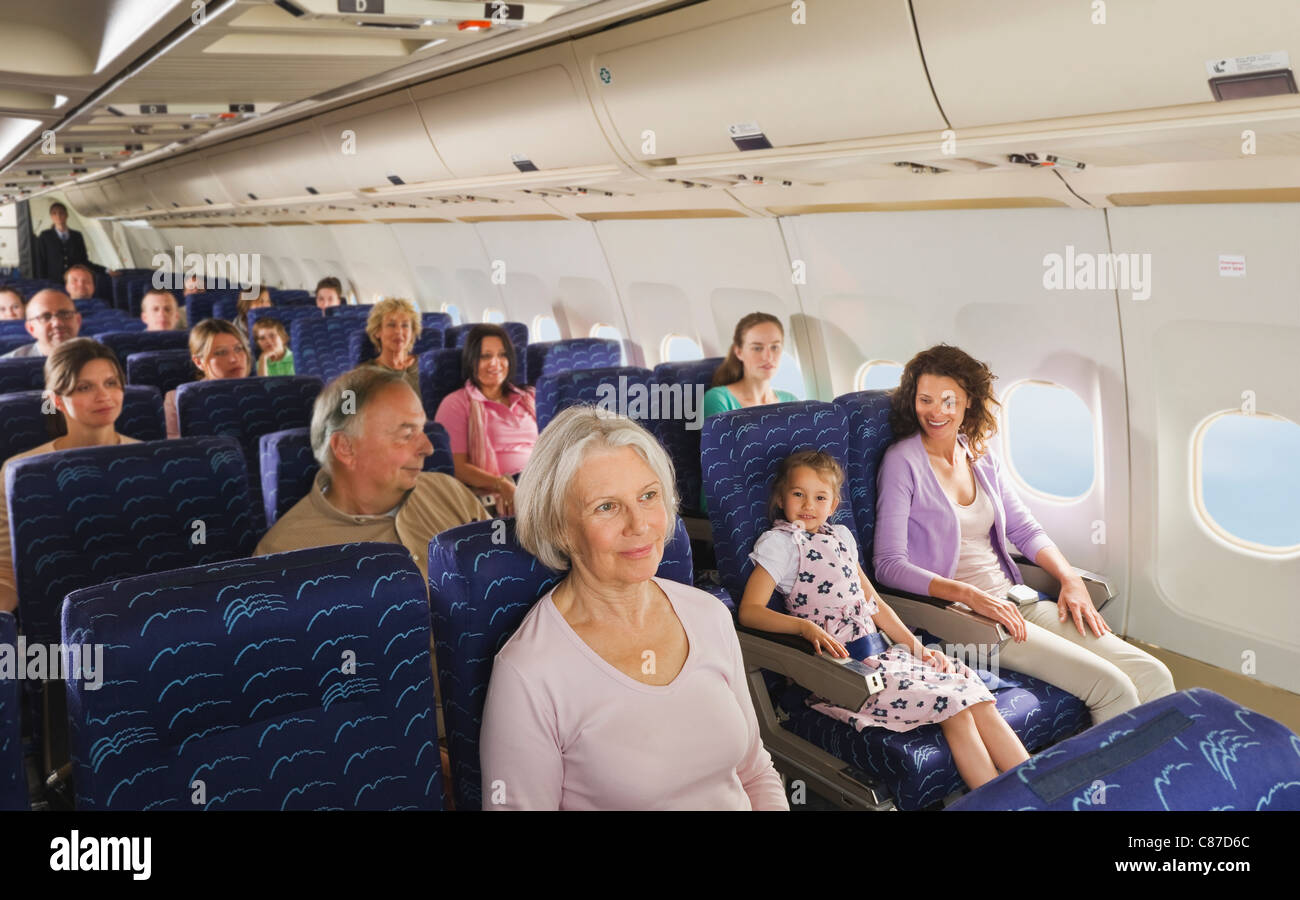 Germany, Munich, Bavaria, People in economy class airliner Stock Photo ...