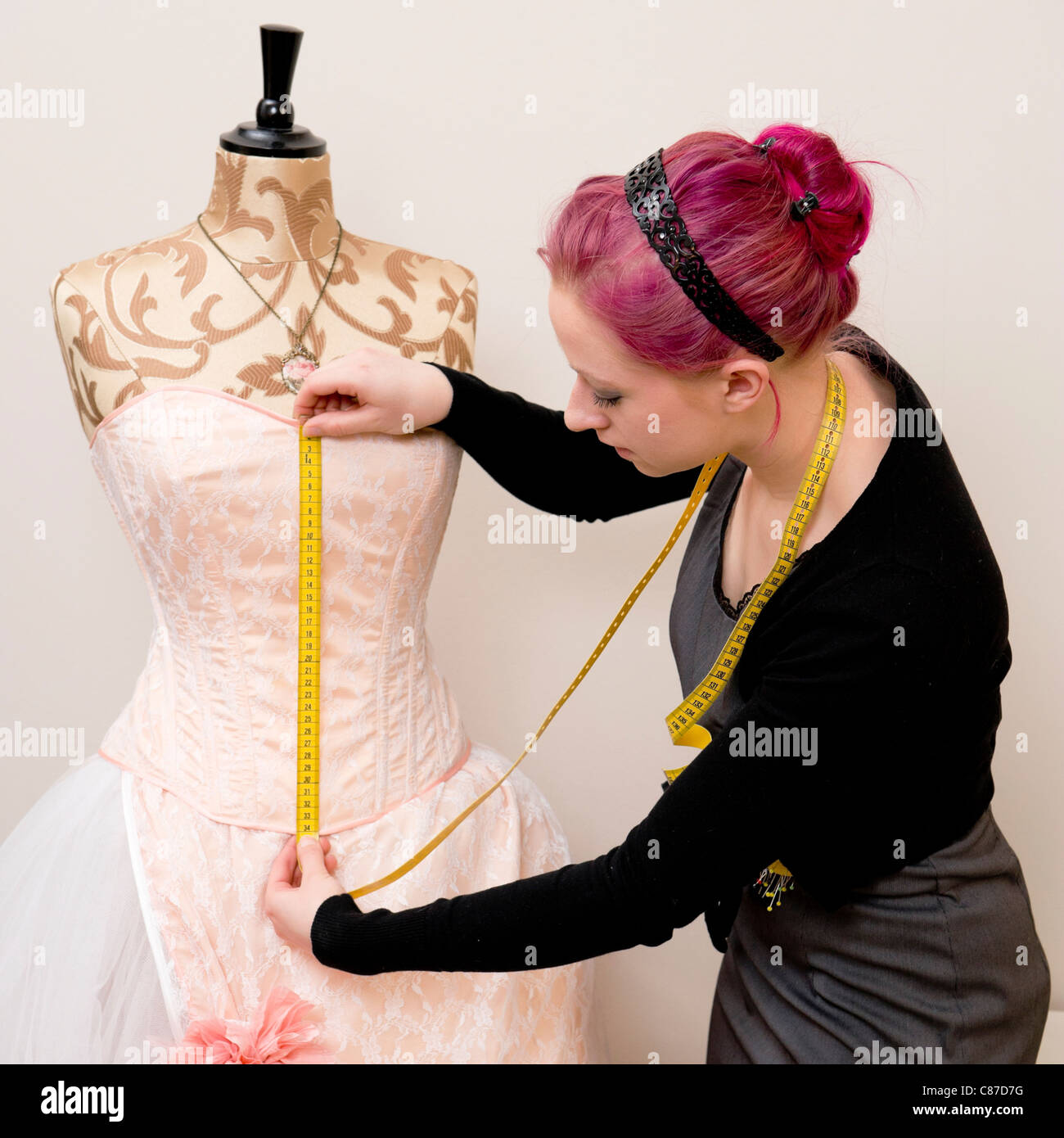 Young dressmaker in her studio Stock Photo - Alamy
