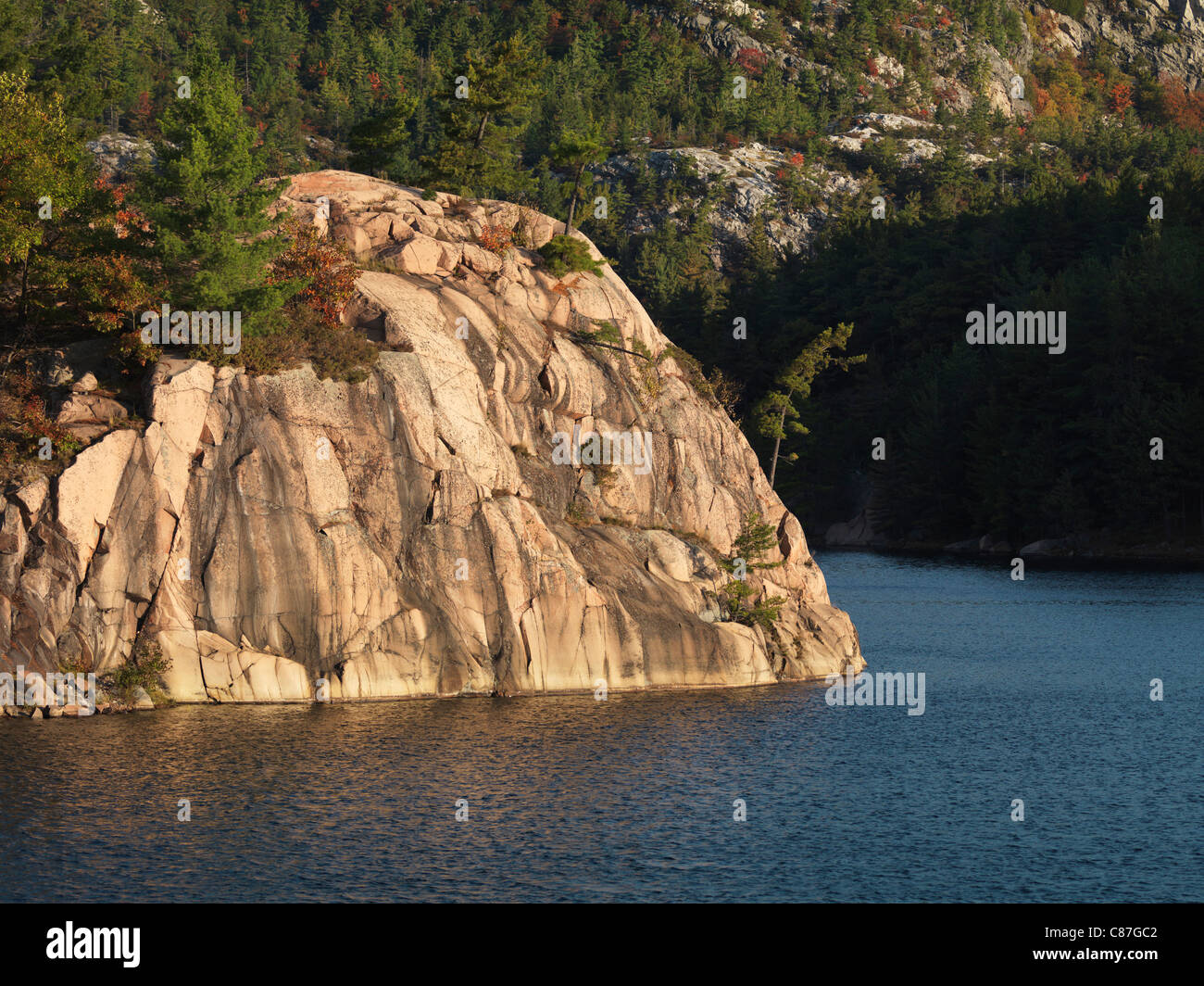 Steep rocky shore of lake George. Beautiful fall nature scenery ...
