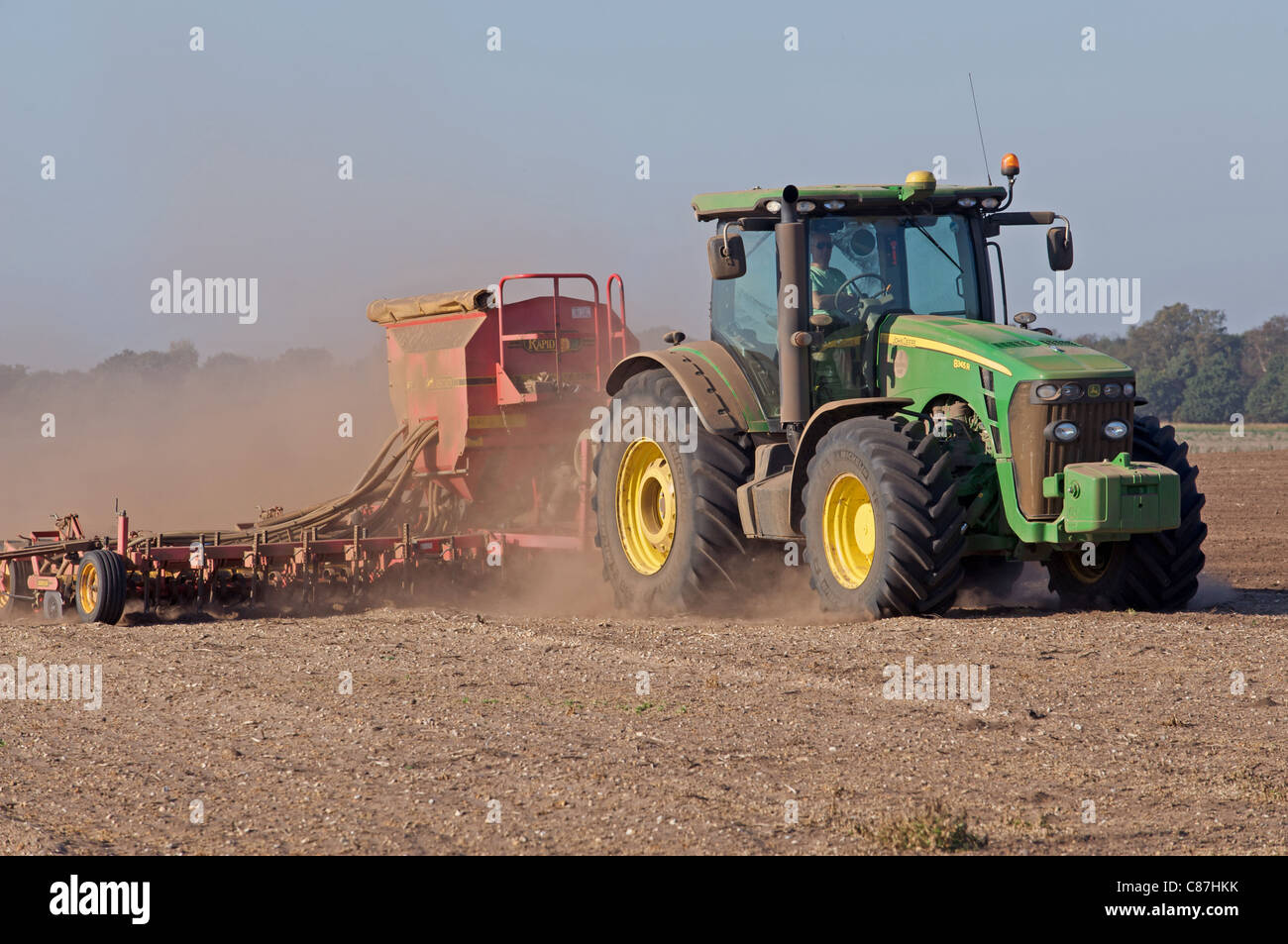 Barley being sewn on a dry and dusty field, Sutton, Suffolk, UK Stock ...