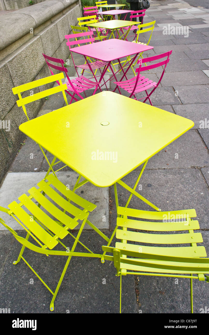 Colourful tables and chairs at an outdoor cafe in London Stock Photo ...