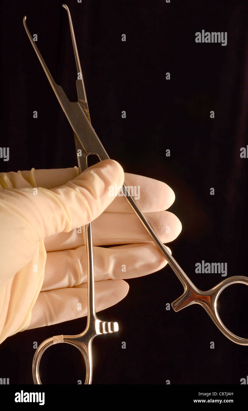 Surgical gloved hand hi-res stock photography and images - Alamy