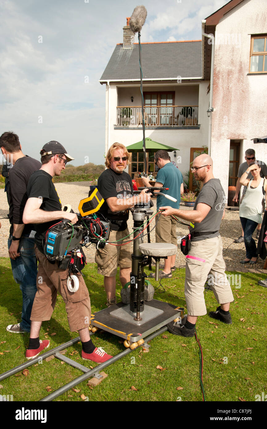 A camera crew working on the location recording of a television drama ...