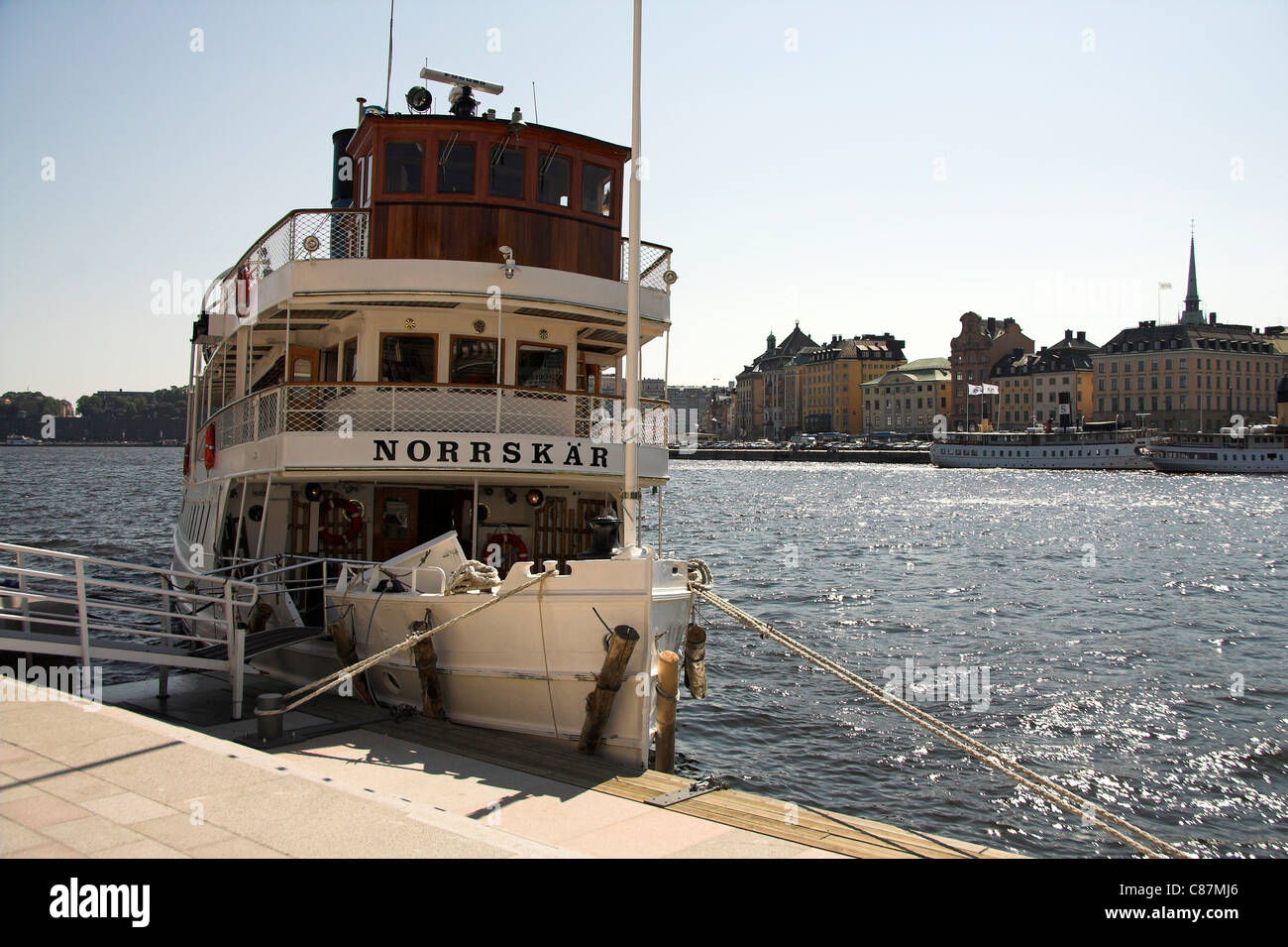 Moored passenger boat, Norrskar, with Gamla stan, the Old Town in the ...