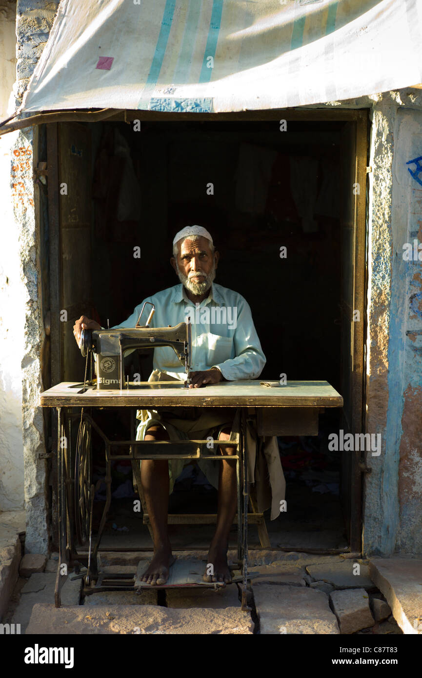 Indian man with sewing machine in village of Rohet in Rajasthan ...