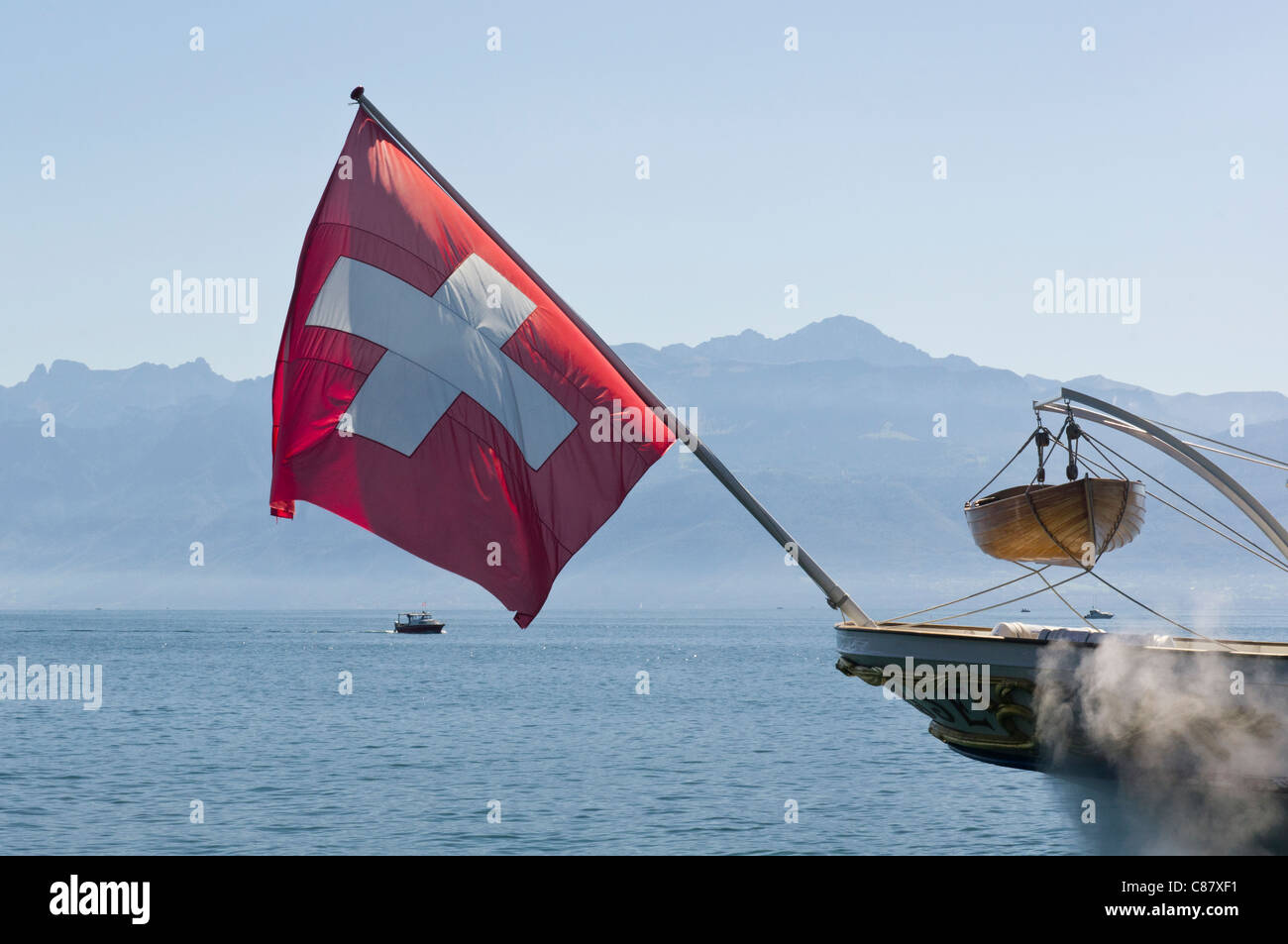 The Swiss flag hangs from the stern of the Lake Geneva paddle steamer ...
