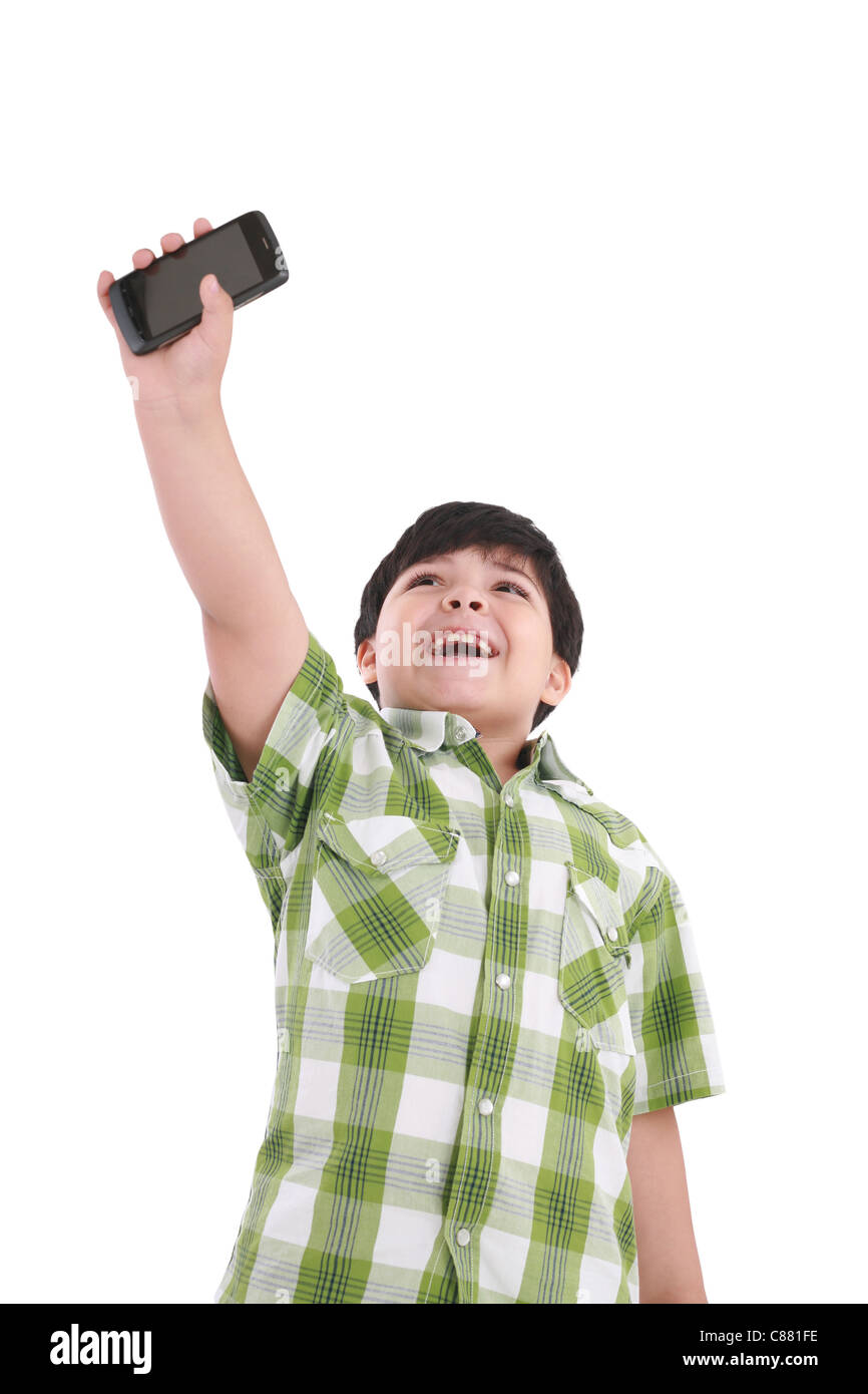 boy holding up cellular phone and smiling Stock Photo - Alamy