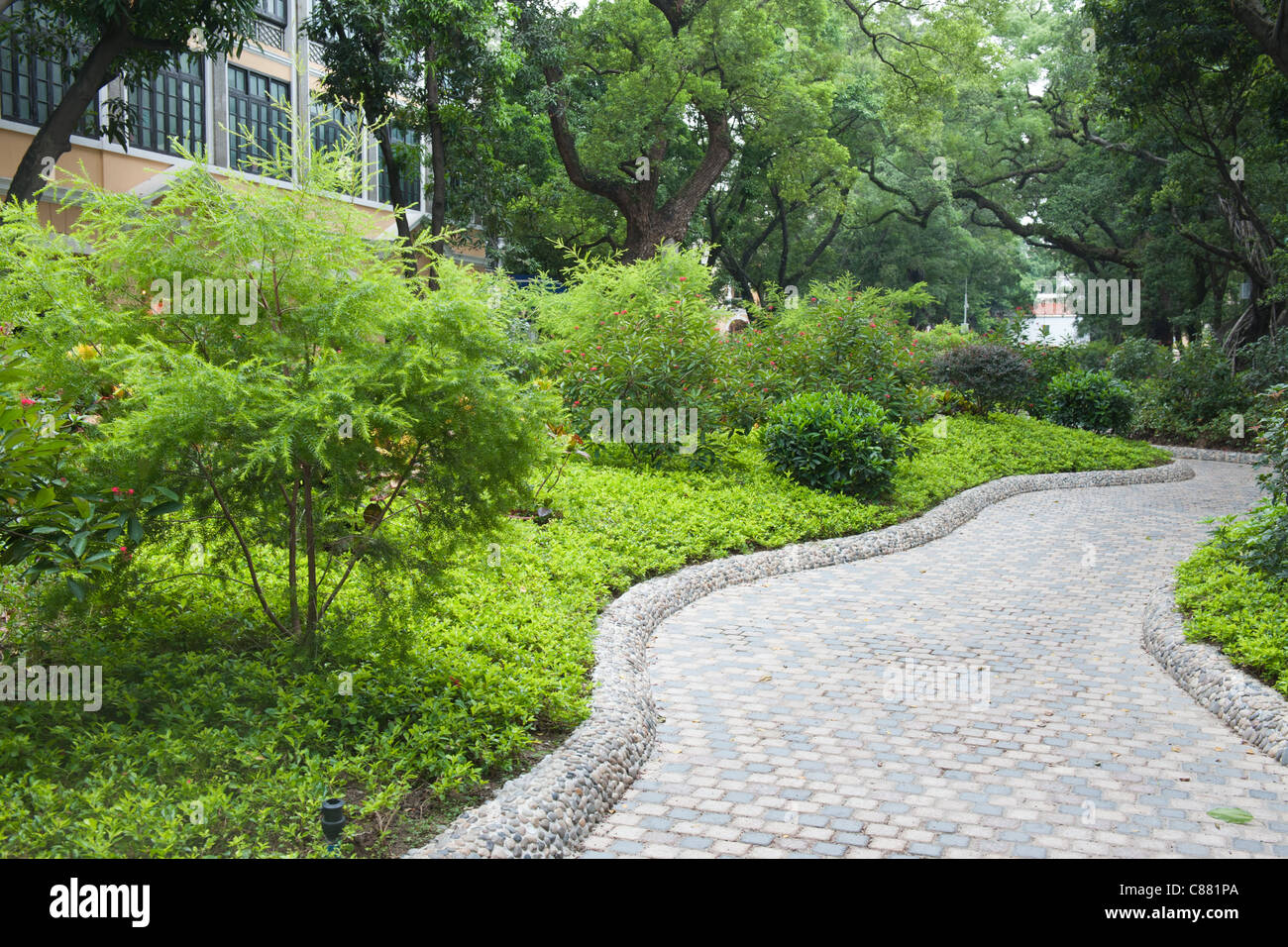 Road in the garden Stock Photo - Alamy