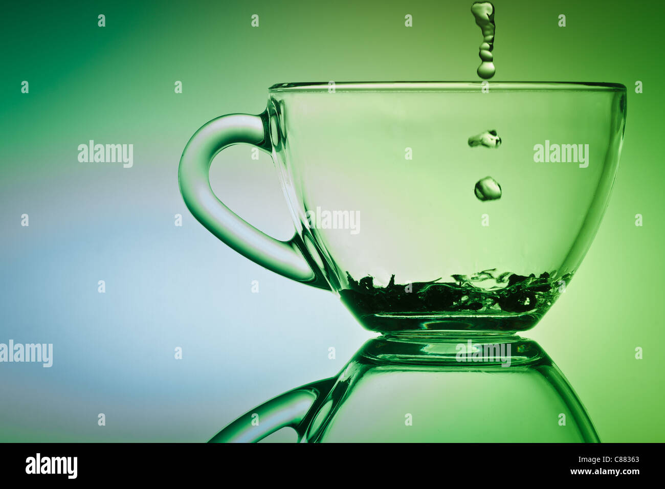 Drop of water falling down to cup of tea Stock Photo - Alamy