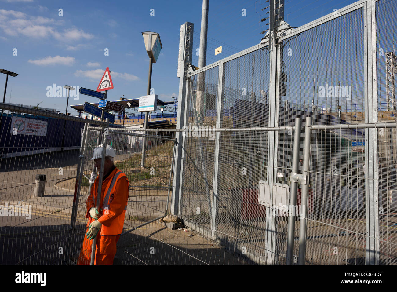 Contractor resets wire barrier to pedestrians at electrified perimeter ...