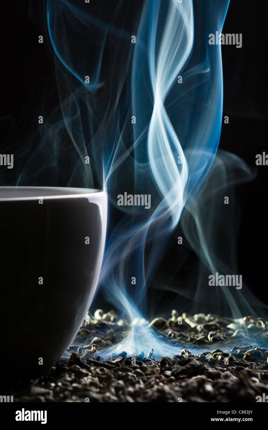 Cup with tea and smoke Stock Photo - Alamy