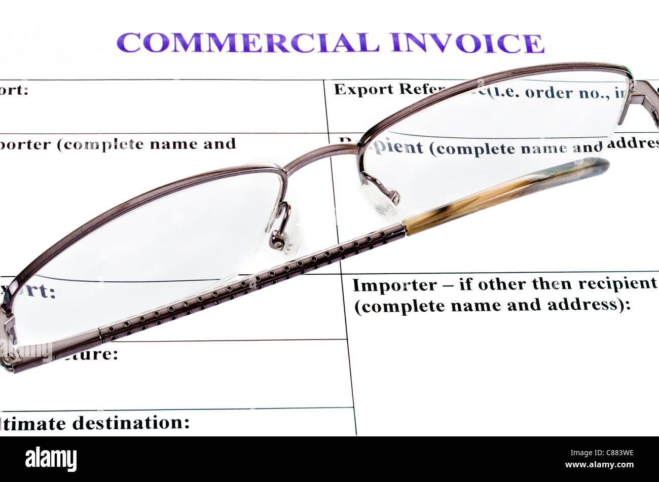 spectacles lie on the form of commercial invoice Stock Photo - Alamy