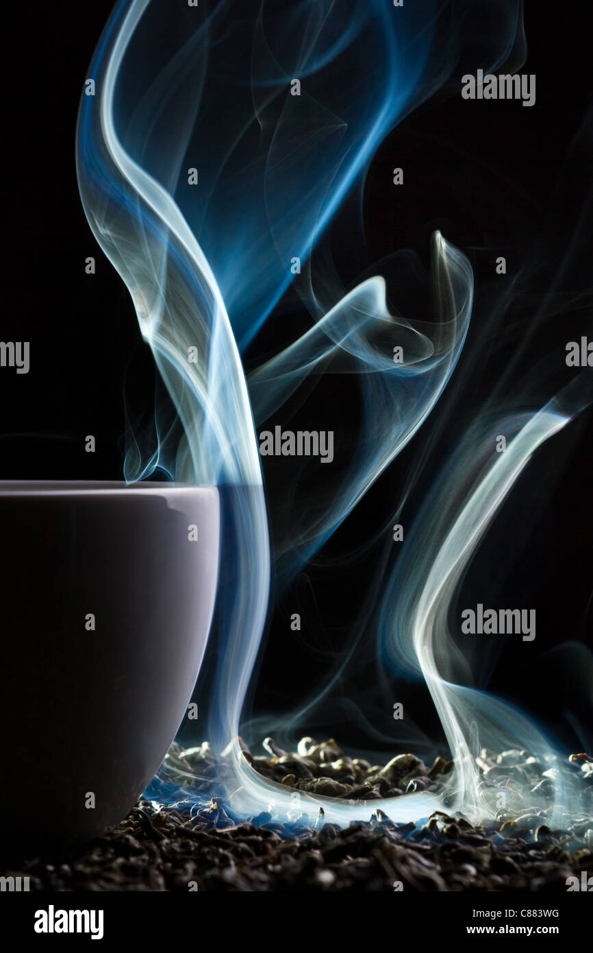 Dry tea with blue smoke Stock Photo - Alamy