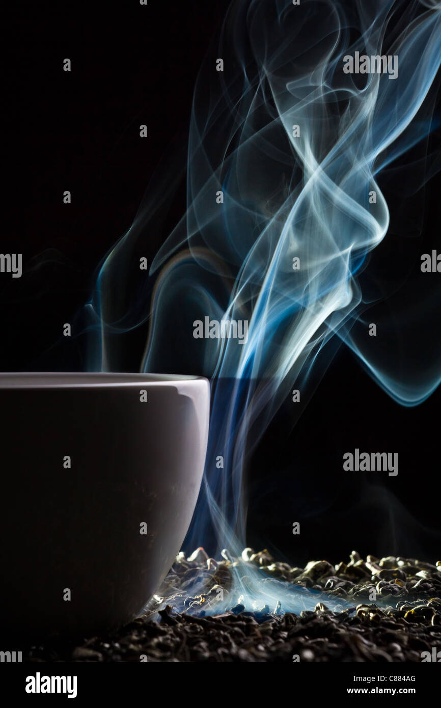 Cup of tea with blue smoke Stock Photo - Alamy