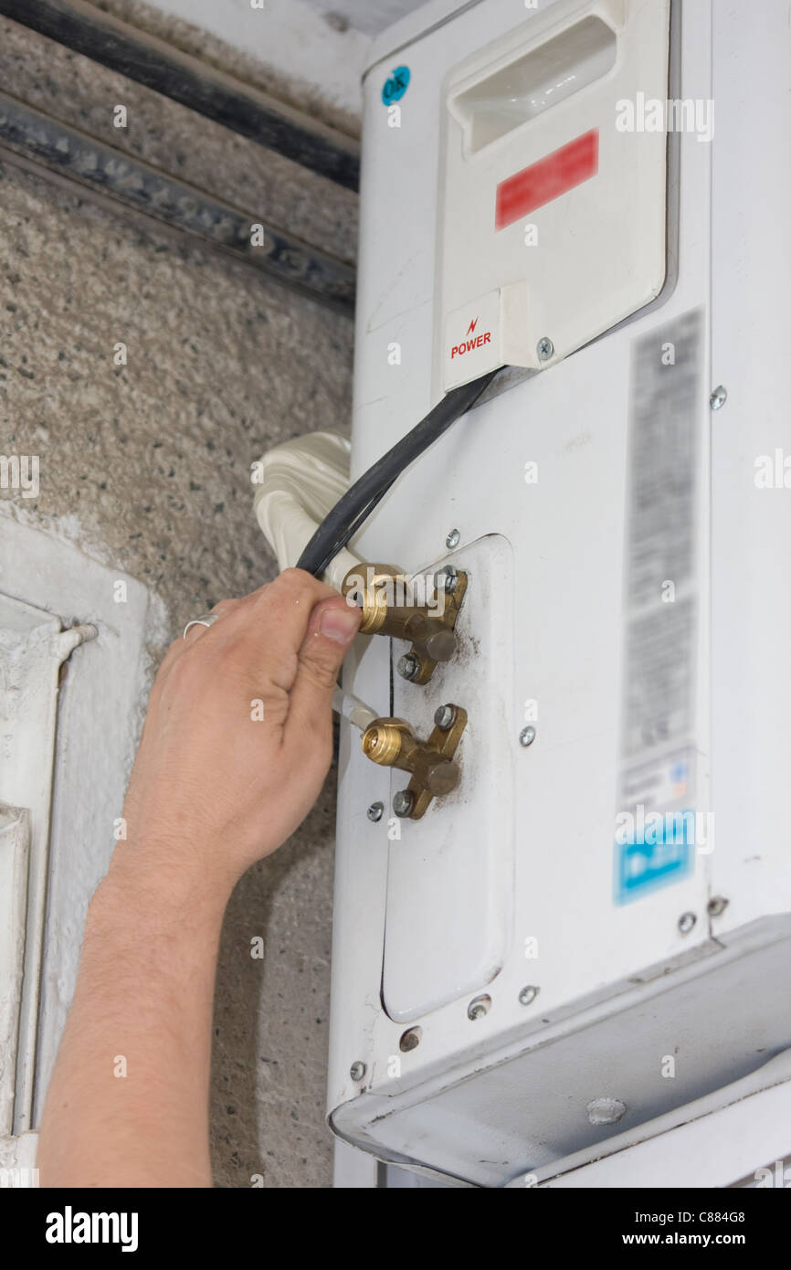 testing A residential central air conditioning unit Stock Photo - Alamy