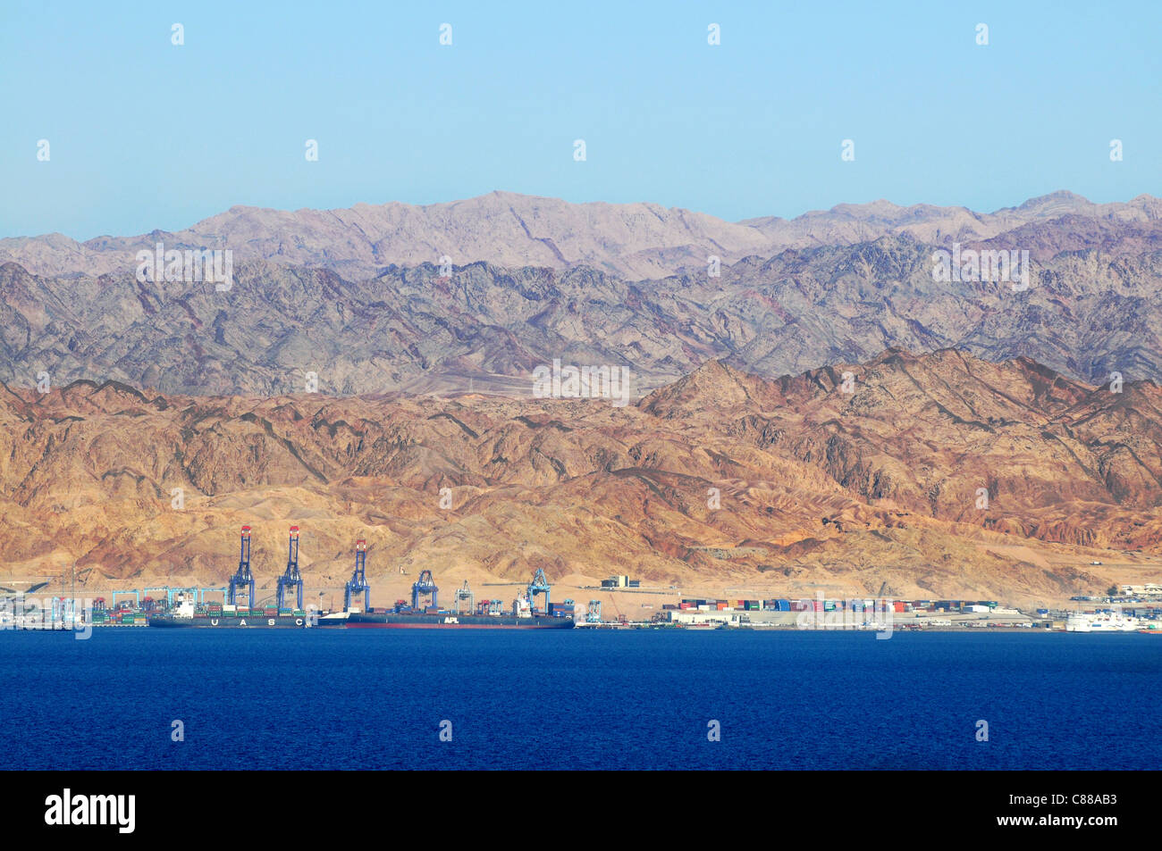 Port in Aqaba coastal city in Jordan, seen from beach in Taba, Egypt ...