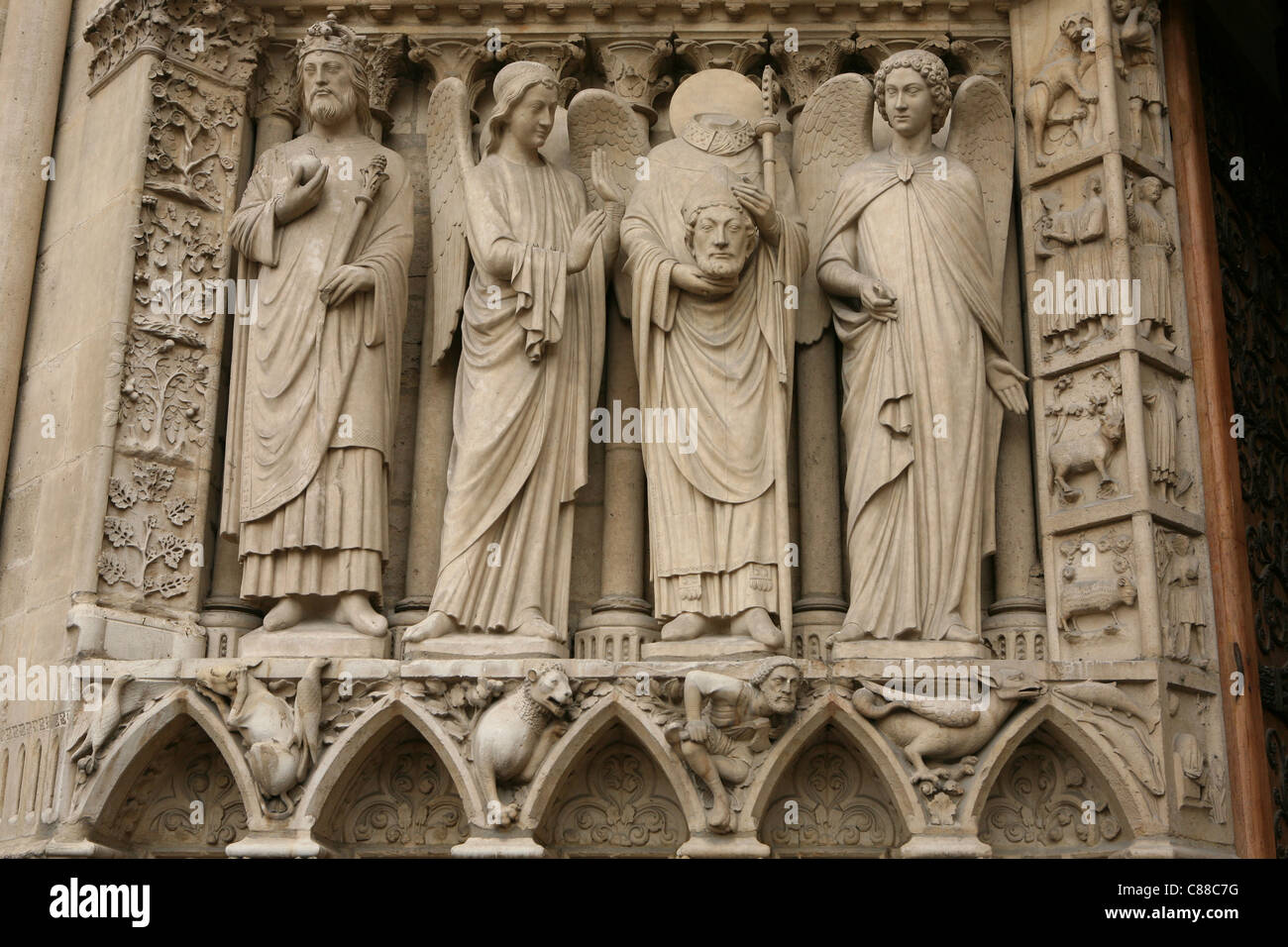 Gothic statues at the portal of the Notre Dame de Paris in Paris ...