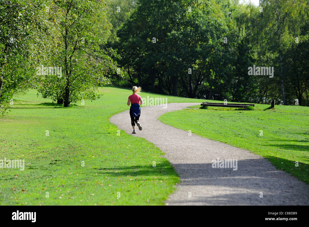 female runner in shipley country park england uk Stock Photo - Alamy