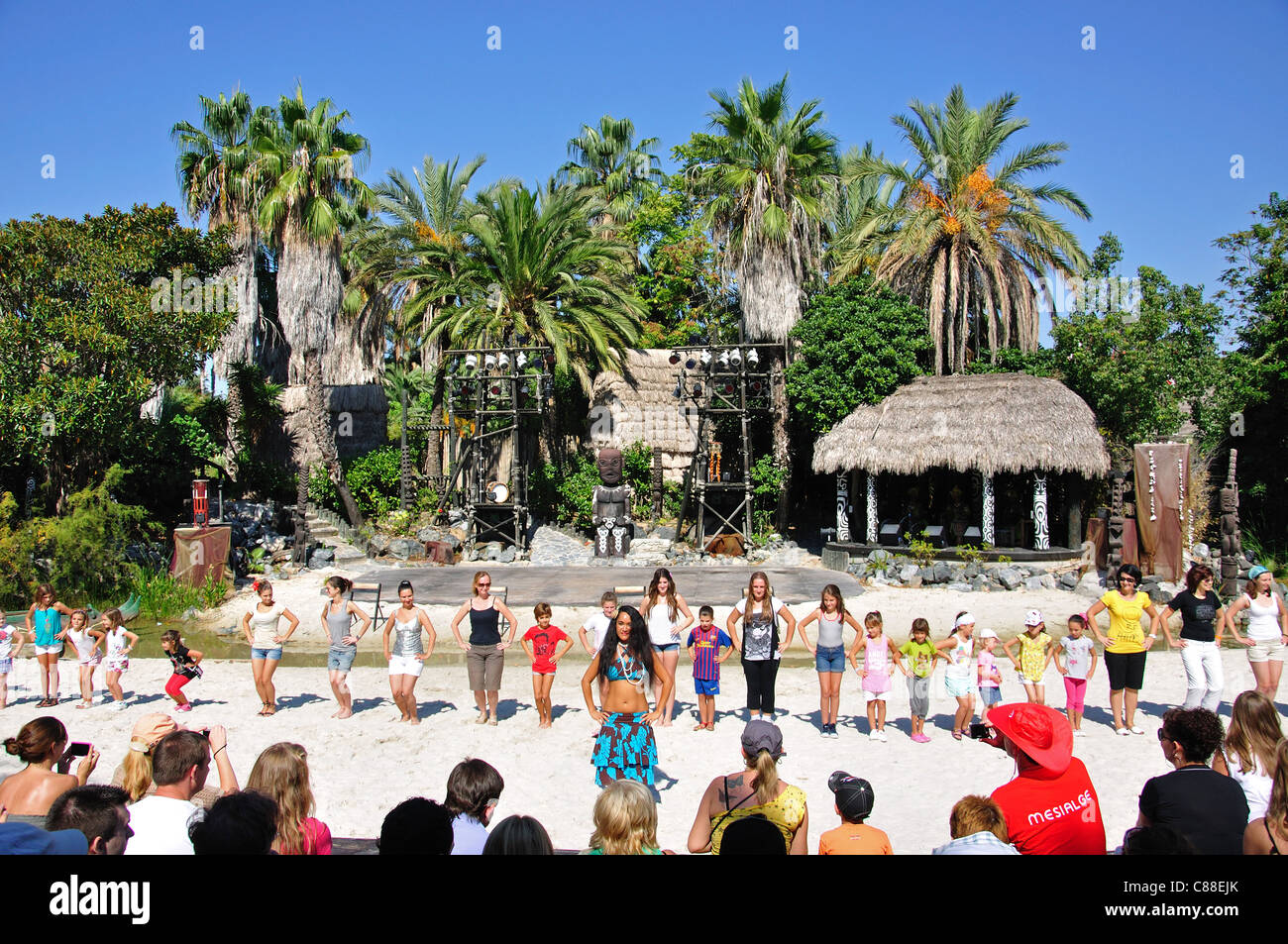 Tourists dancing at Polynesian Show, PortAventura Theme Park, Salou ...