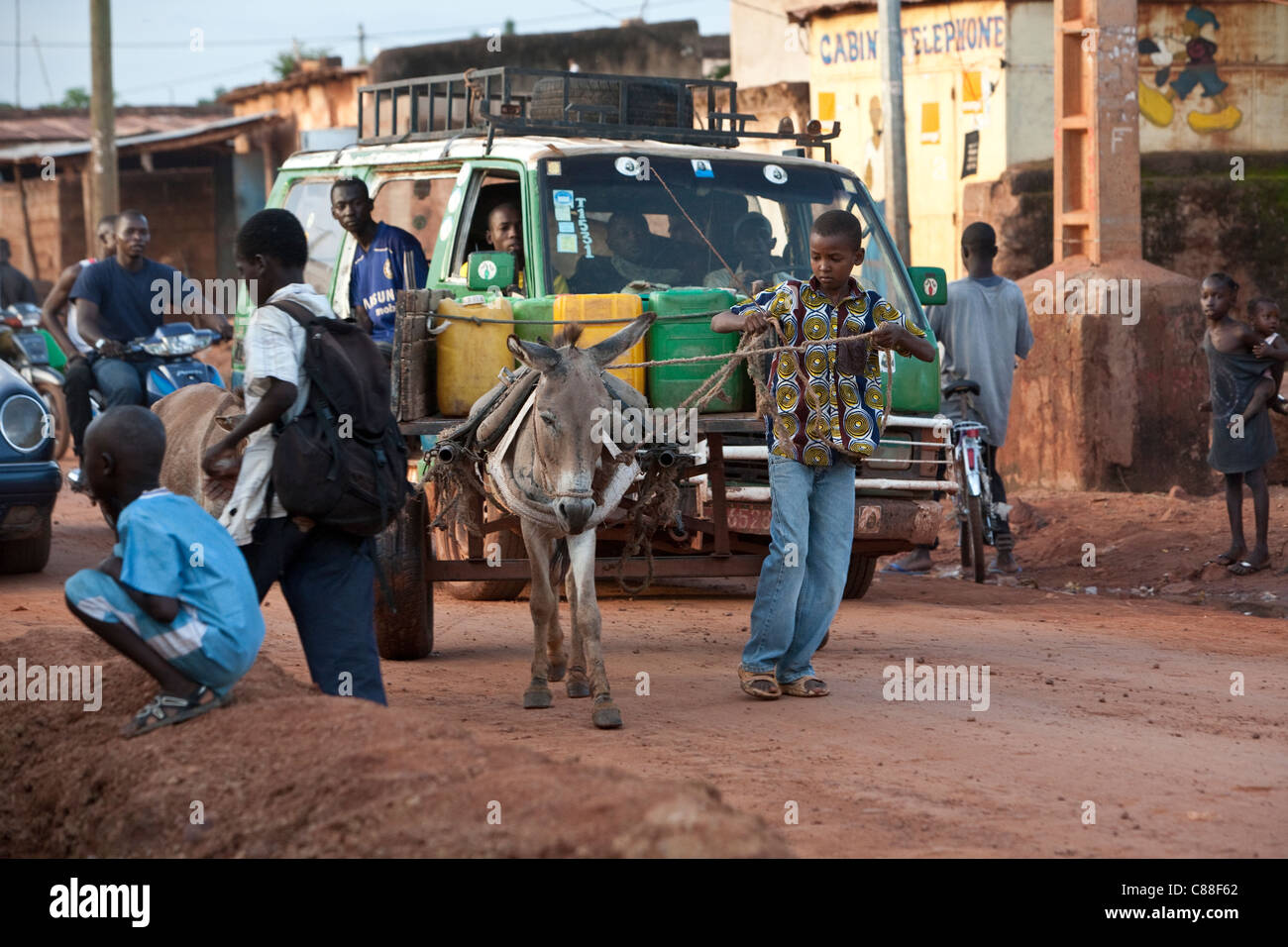 Traffic moves down a main road in Banconi, a crowded suburb of Bamako ...