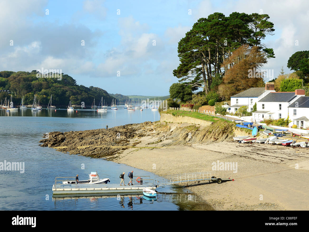 people using the ferry at helford passage on the helford river in ...
