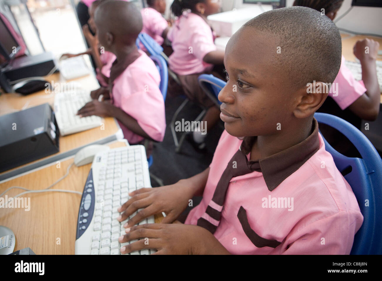 Students learn in a computer lab at a school in Dar es Salaam, Tanzania ...