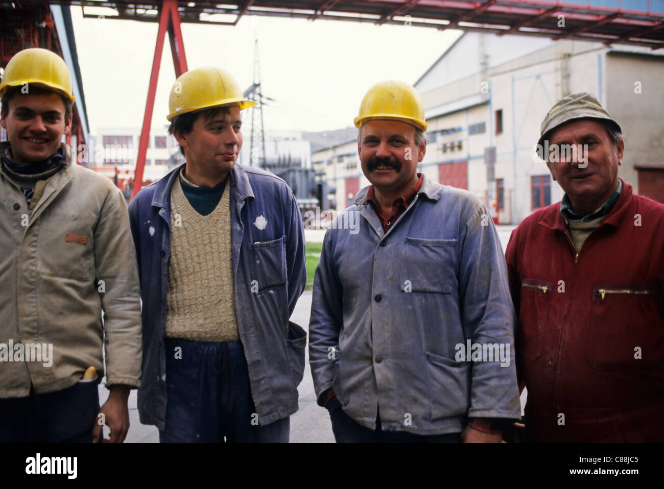 Bratislava, Slovakia: factory workers in hard hats and overalls Stock ...