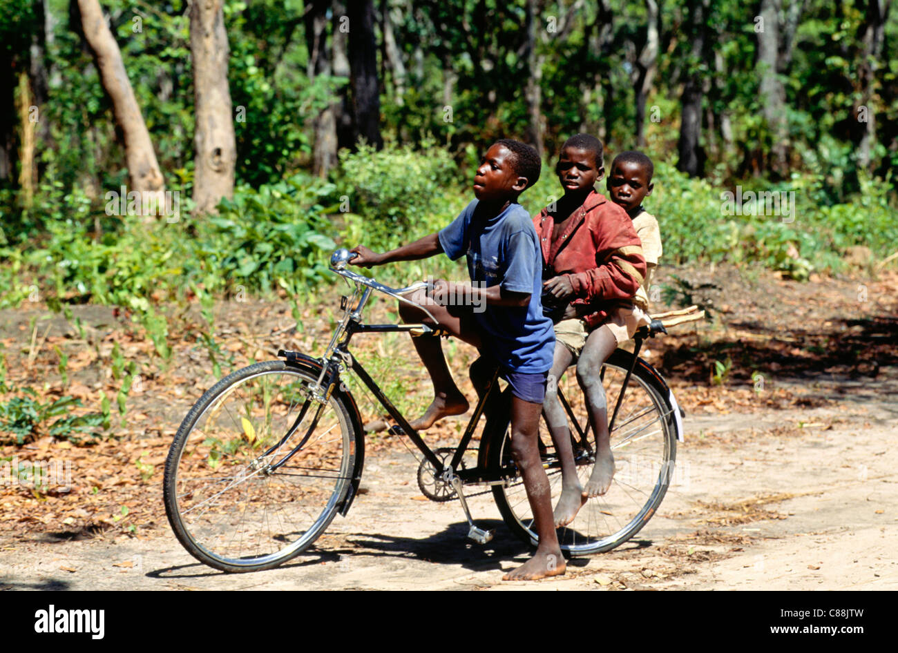 Black boys on bike hi-res stock photography and images - Alamy