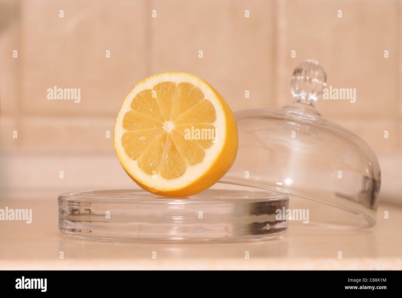 yellow lemon in kitchen - container Stock Photo - Alamy