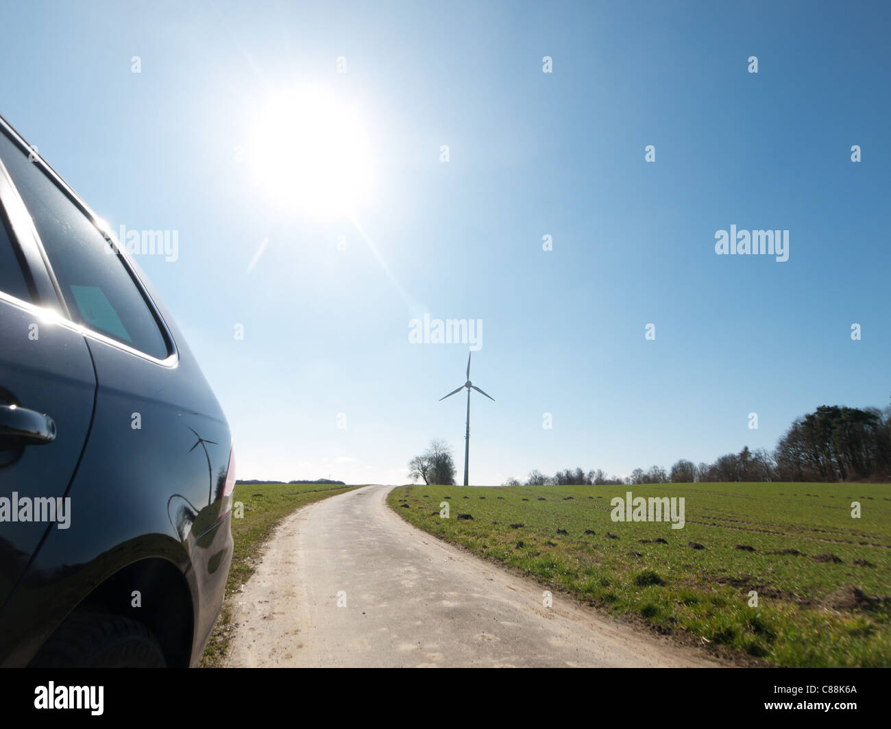 Car and wind turbine Stock Photo - Alamy