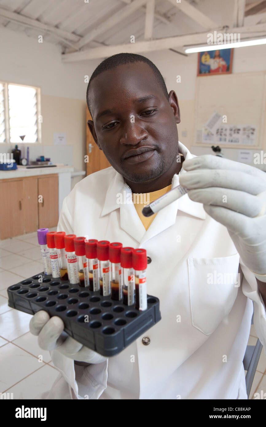 A Laboratory technicians test blood samples of HIV patients at a ...