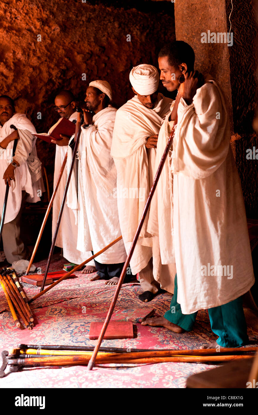 Orthodox Christian pilgrims singing prayers in a cave near the entrance ...