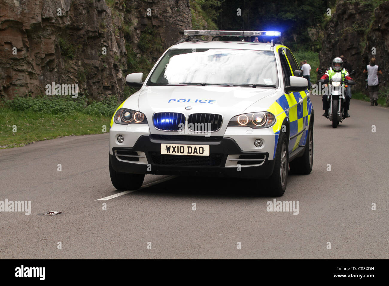 Police 4x4 running under blue lights Stock Photo - Alamy