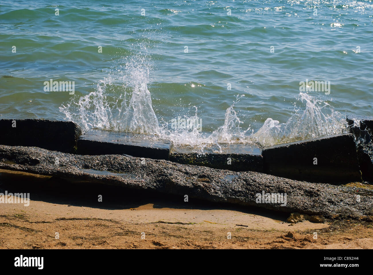 splash of sea drops on beach Stock Photo - Alamy