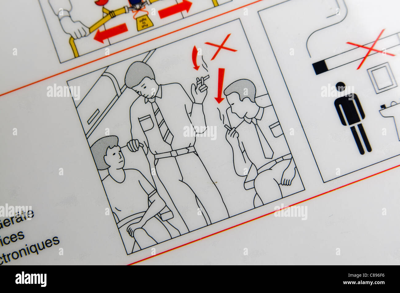 Closeup of an airline safety card warning against smoking on board ...