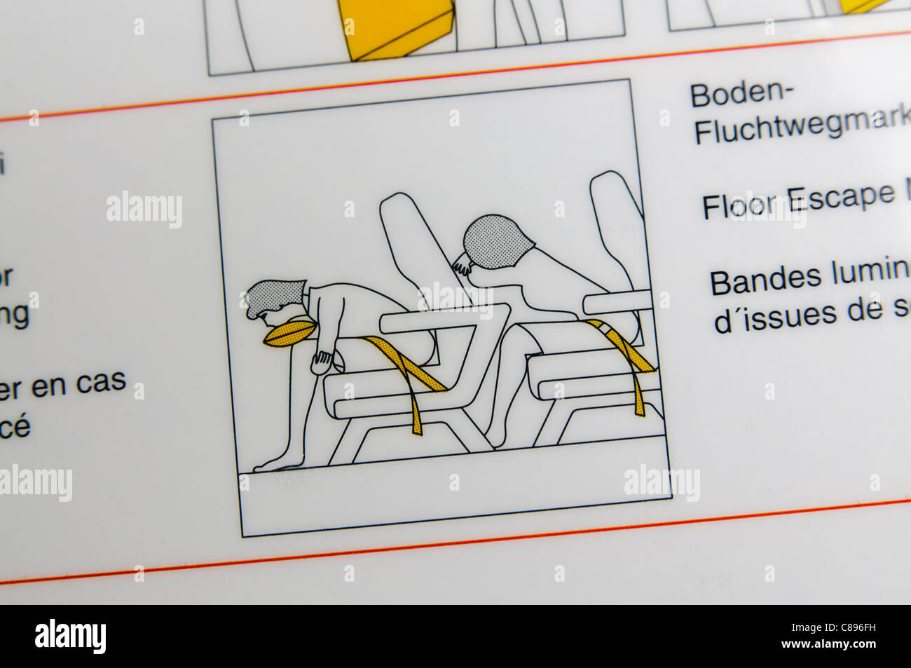 Closeup of an airline safety card showing the "Brace" position Stock ...