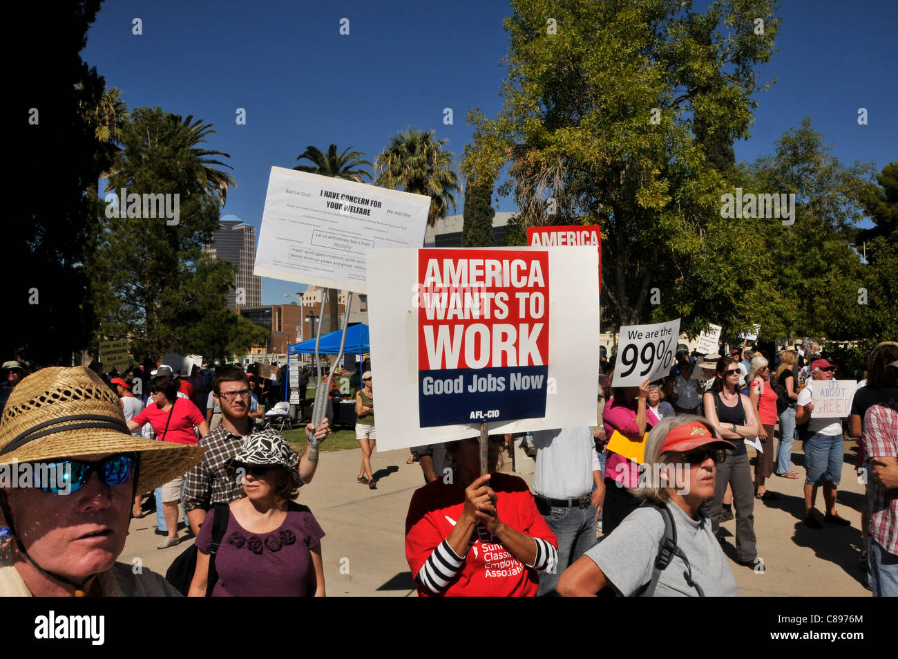 Dominga Sierra (holding sign) protests, along with about 1,000 ...