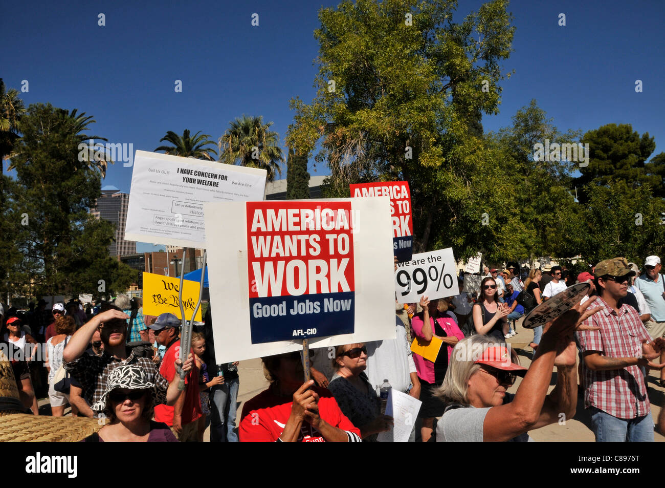 Dominga Sierra (holding sign) protests, along with about 1,000 ...