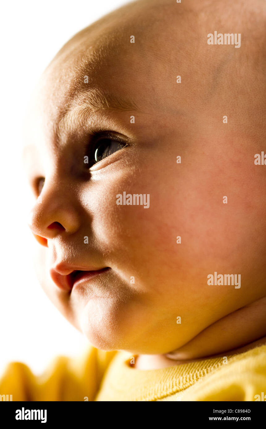 young child looking to the left in dramatic light Stock Photo - Alamy