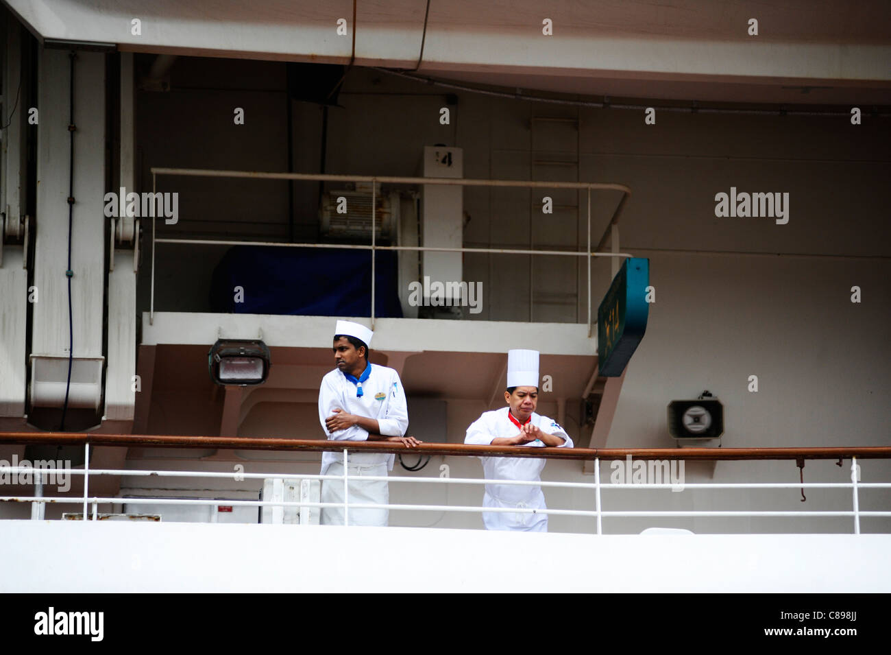 Two cruise ship chefs relaxing Stock Photo - Alamy