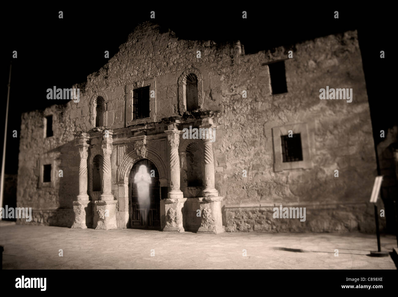 Ghost at the front door of the Alamo at night Stock Photo - Alamy