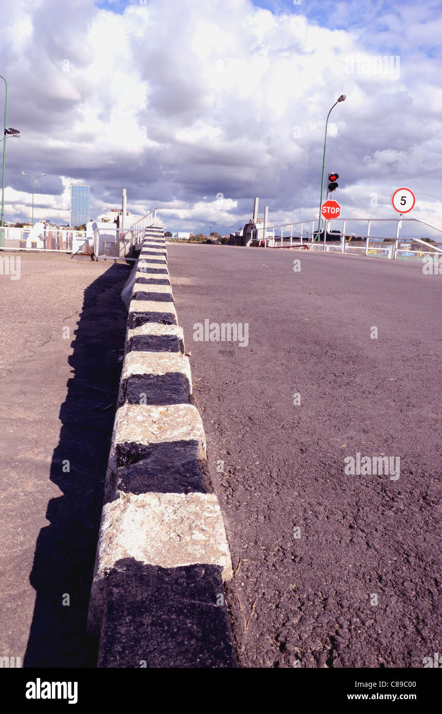 Striped border. Traffic lights and stop sign before the bascule bridge ...